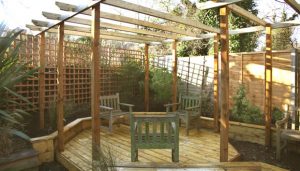 Pergola with octagonal decking | Brightling Garden Designs